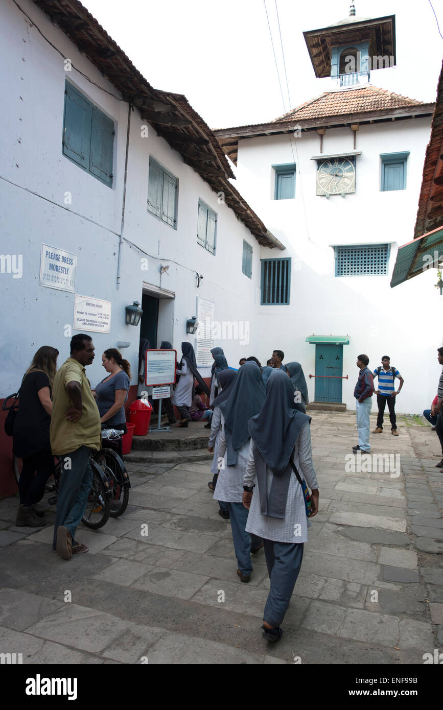 Visitors at the main entrance to the Paradesi Synagogue at Fort Cochin ...