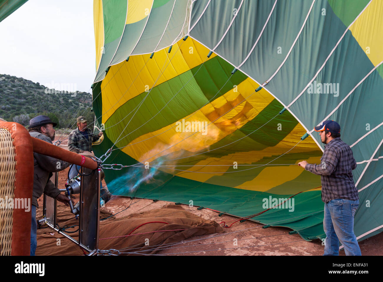 Sedona, Arizona - April 12 : Crew members heating up the balloon and ...