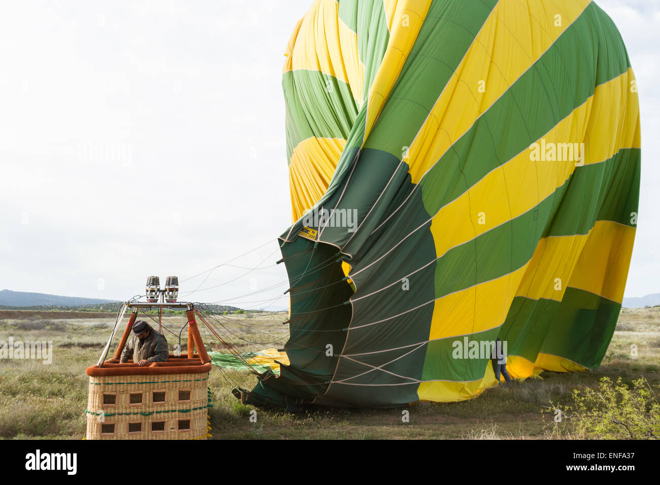 Sedona, Arizona - April 12 : Crew members guiding a deflating balloon ...