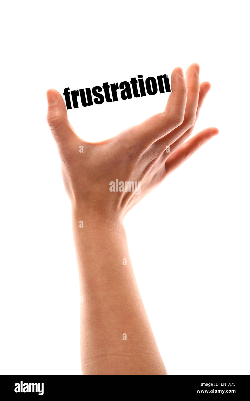Color horizontal shot of a of a hand squeezing the word "frustration ...