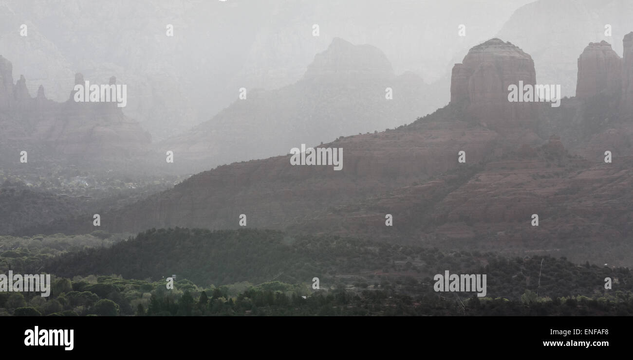 Aerial view of the red rock landscape of Sedona Arizona with smoke from ...