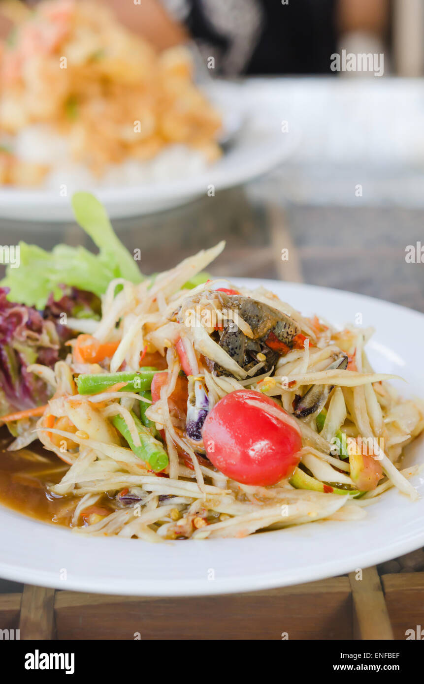 Thai spicy papaya salad serve with vegetables Stock Photo - Alamy