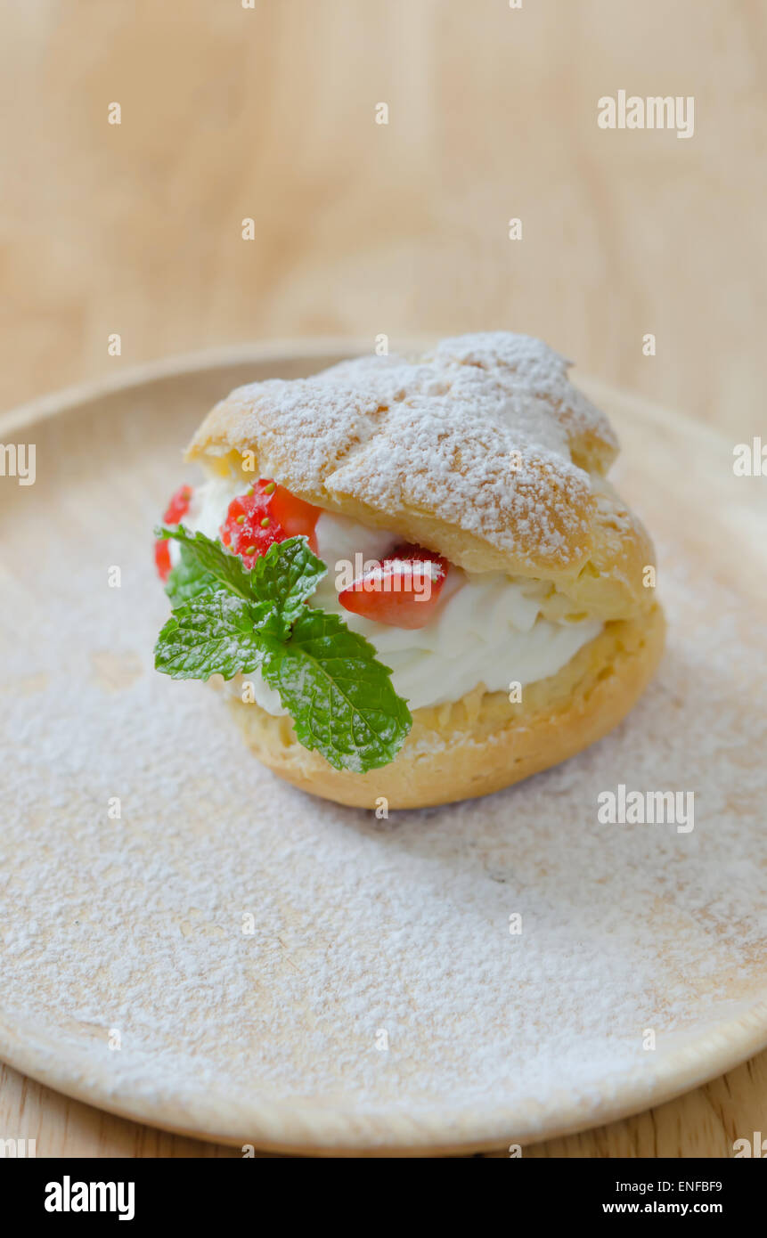 fresh strawberry Choux Cream on wooden dish Stock Photo - Alamy