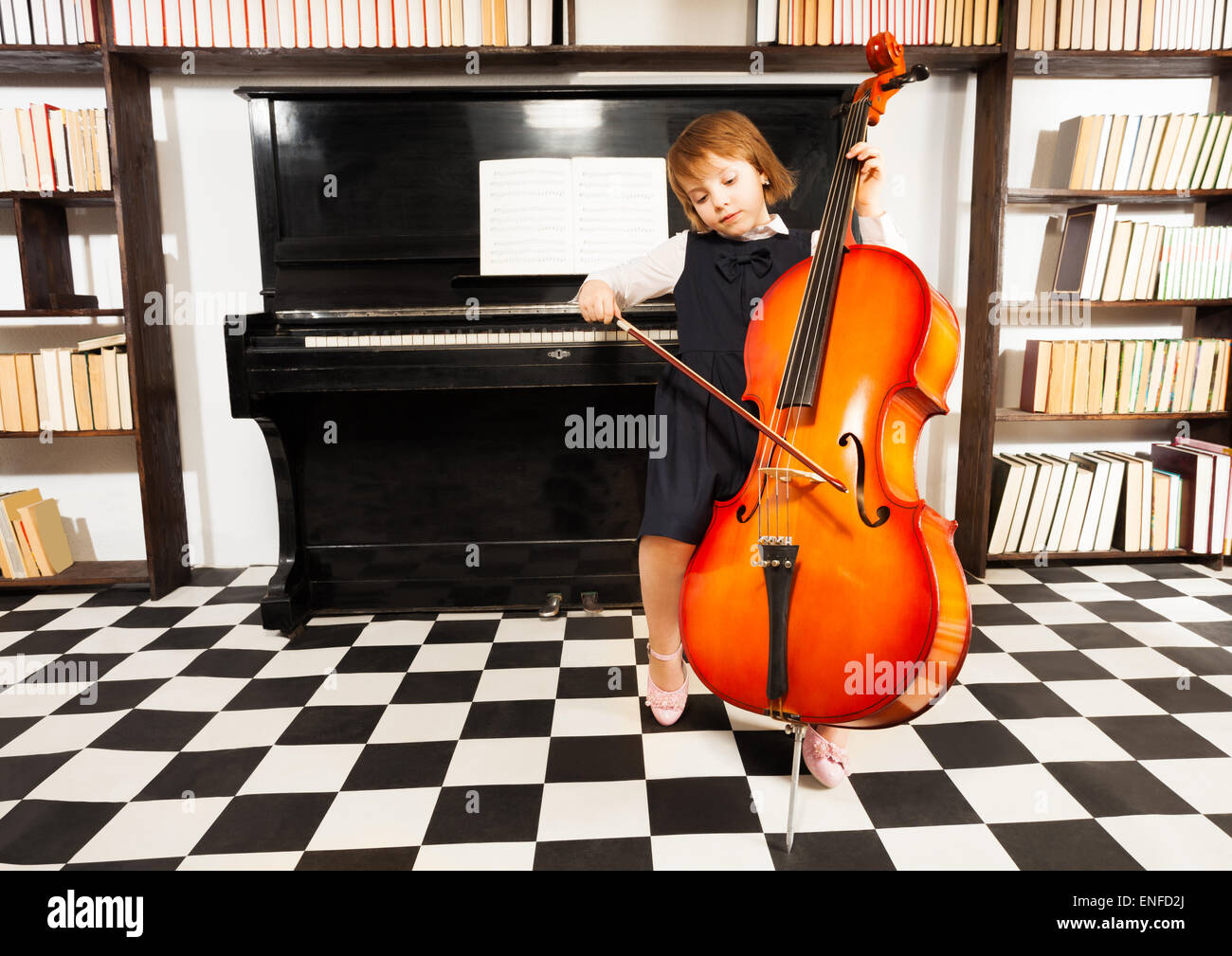 Child playing cello at concert hi-res stock photography and images - Alamy