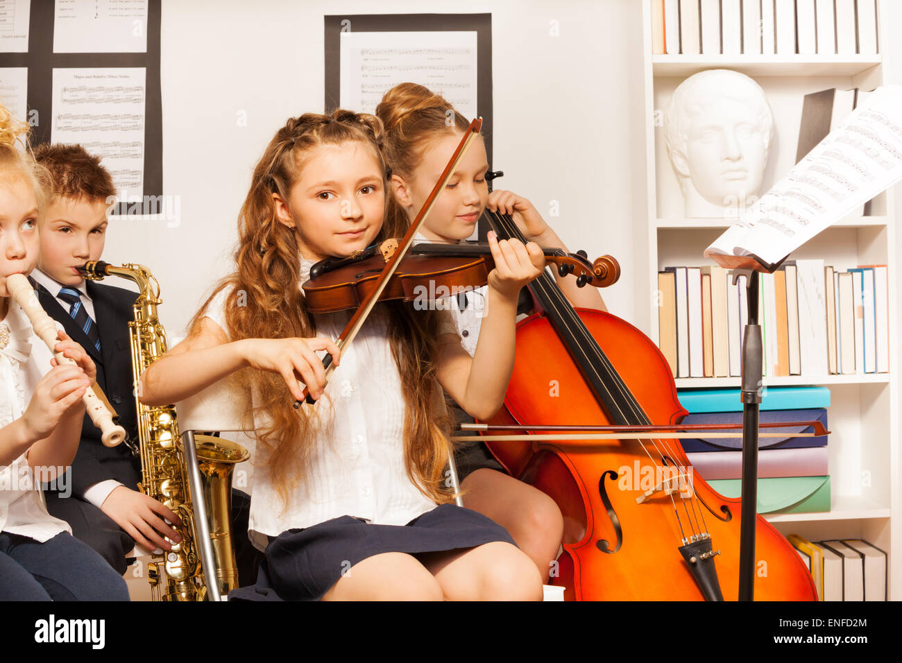 Group of kids playing musical instruments indoors Stock Photo - Alamy
