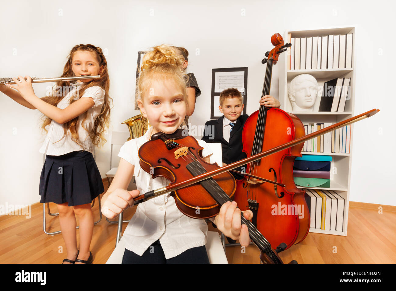 Girl and boy playing saxophone hi-res stock photography and images - Alamy