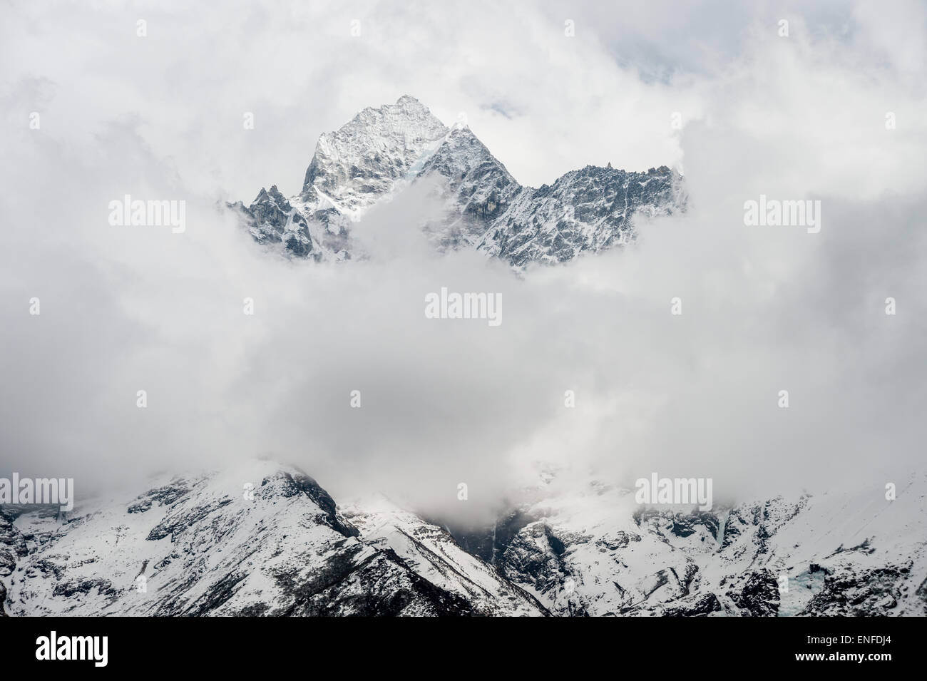 Himalayan summit emerging from the clouds in Nepal Stock Photo - Alamy
