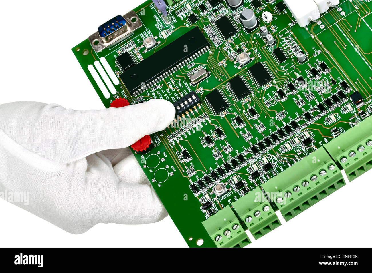 A circuit board hand held with white gloved hand isolated on white ...