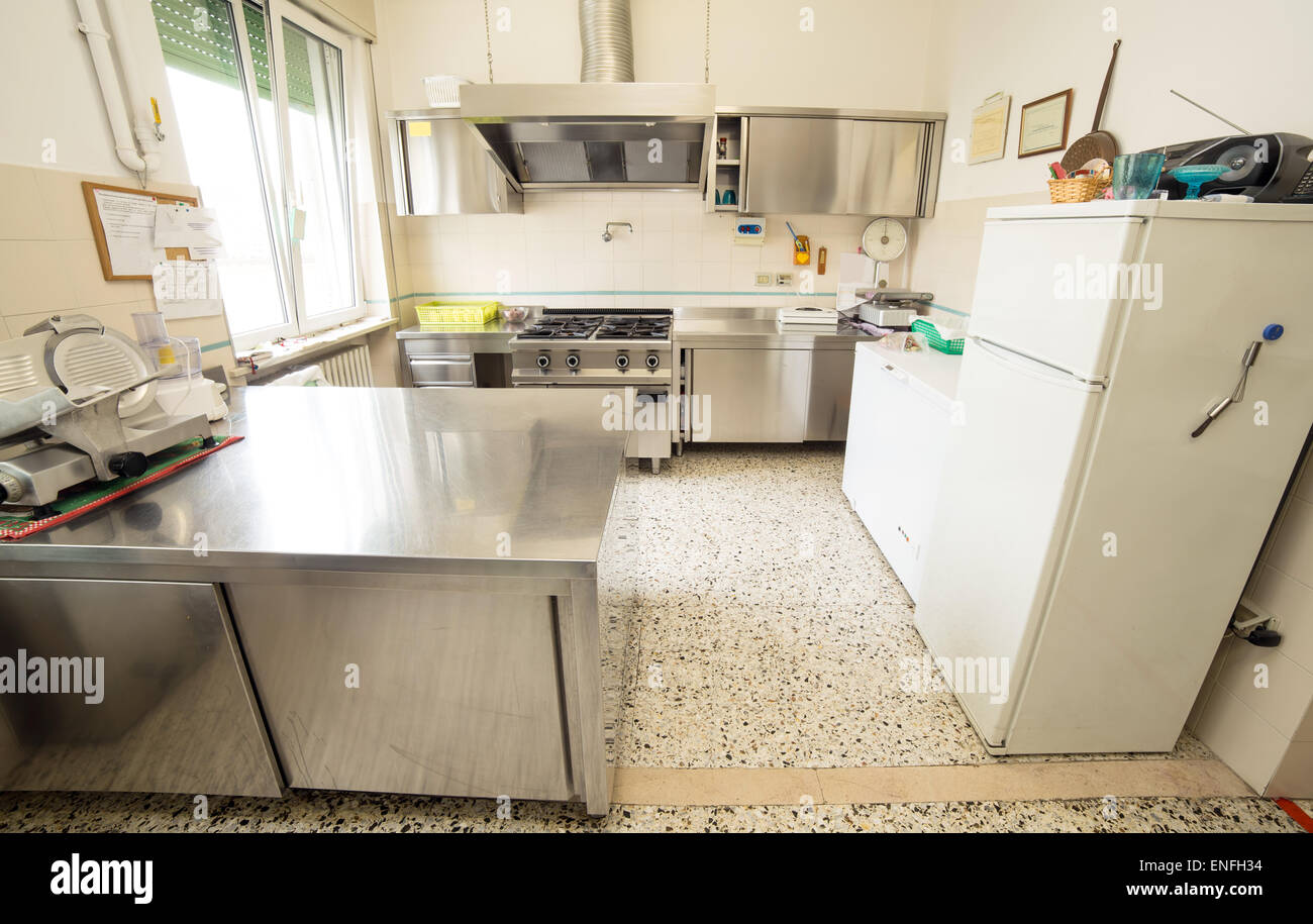 kitchen stainless steel industry with large gas stove and an industrial ...