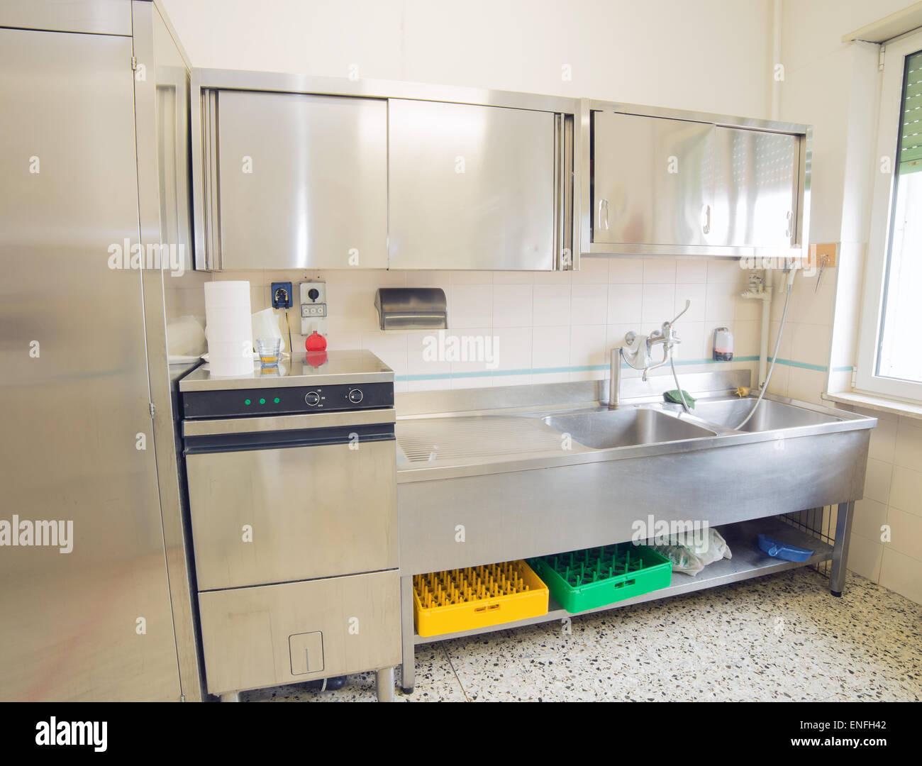 large industrial kitchen with refrigerator, dishwasher and sink all ...