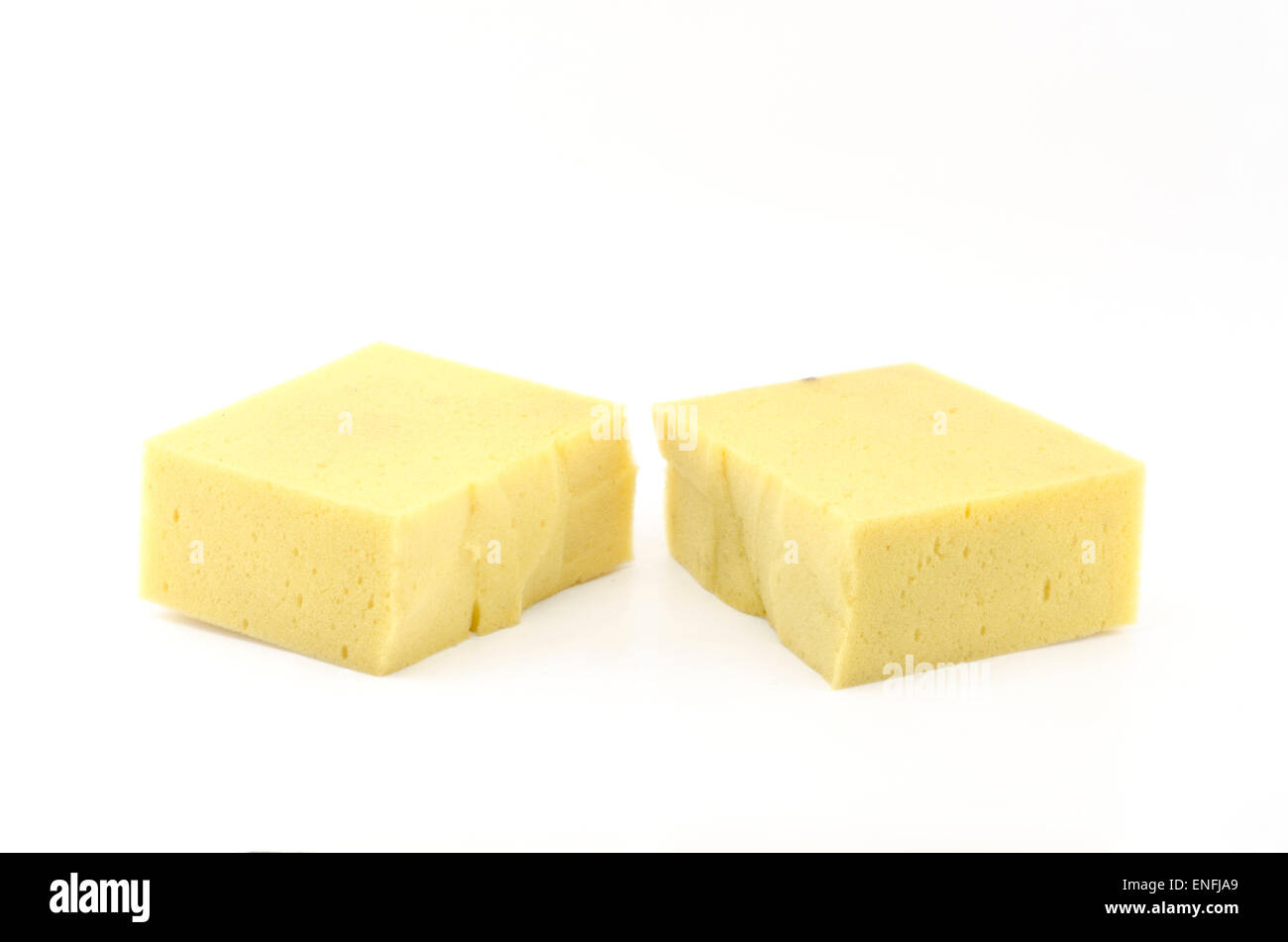 two piece yellow household sponge isolated on white background Stock ...