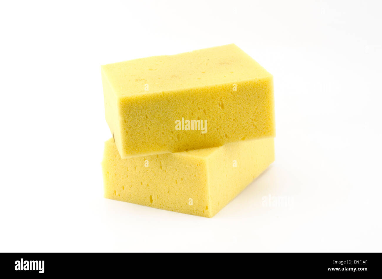 two piece yellow household sponge isolated on white background Stock ...