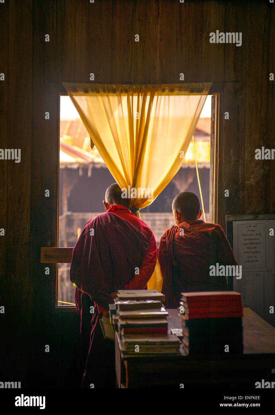Novices Monks Looking Thru A Window, Inle Lake, Myanmar Stock Photo - Alamy