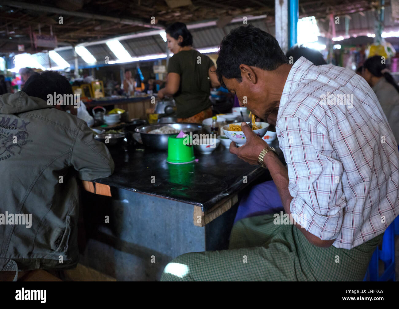 Man Eating In A Restaurant Inside A Market, Thandwe, Myanmar Stock ...