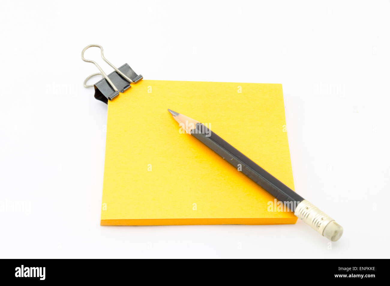 orange sticky note with black pencil isolated on white background Stock ...