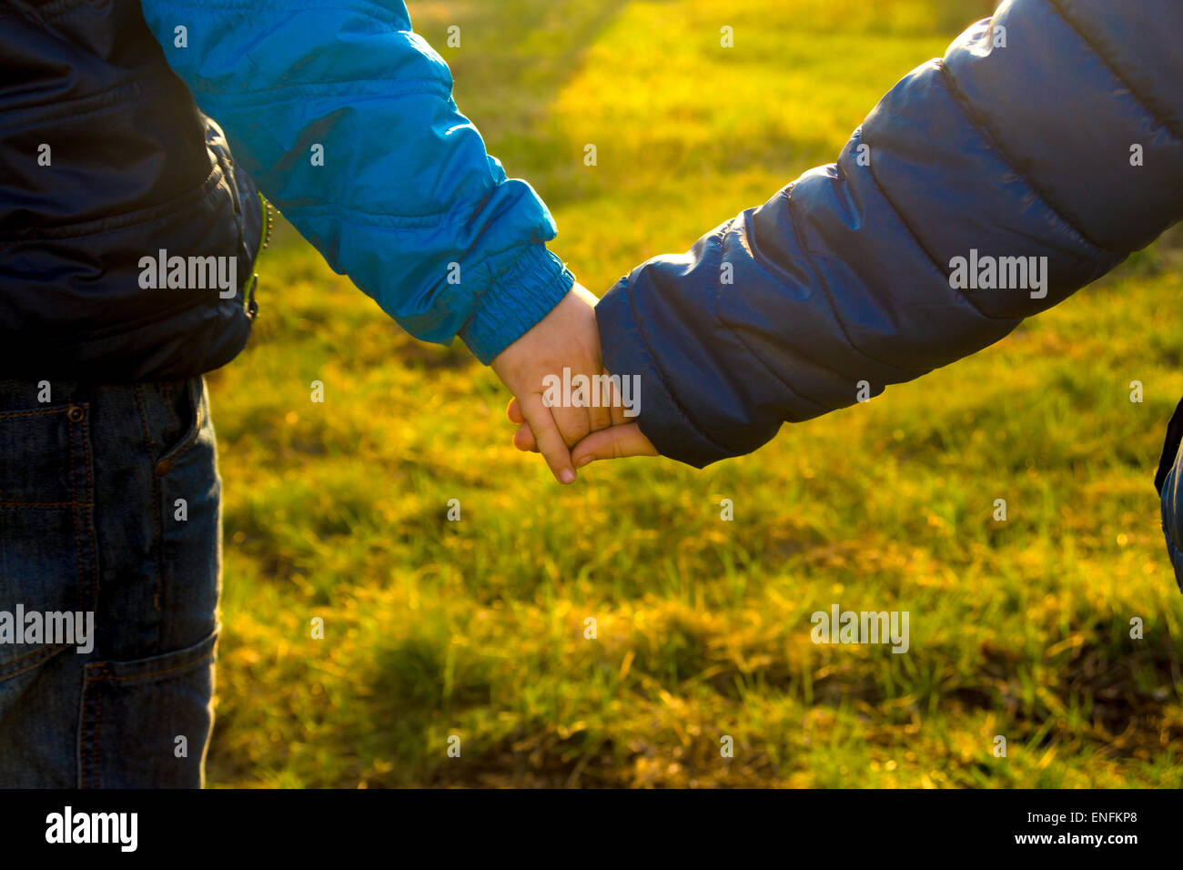 Two teen boys holding hands hi-res stock photography and images - Alamy