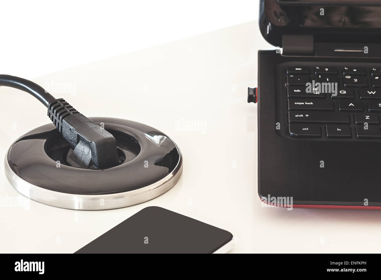 Details of an electric plug built in table Stock Photo - Alamy