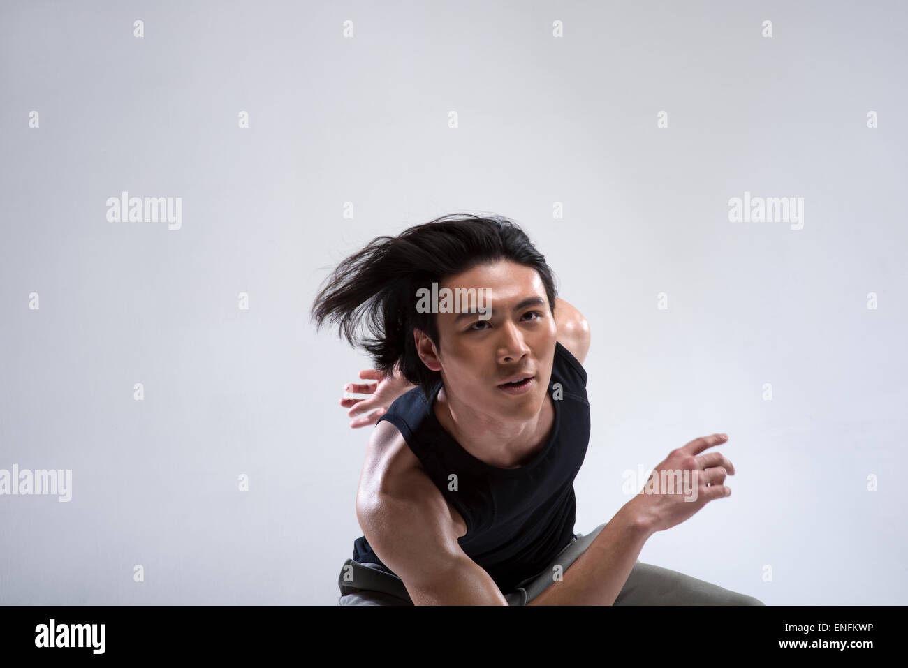 Young man doing exercise Stock Photo - Alamy