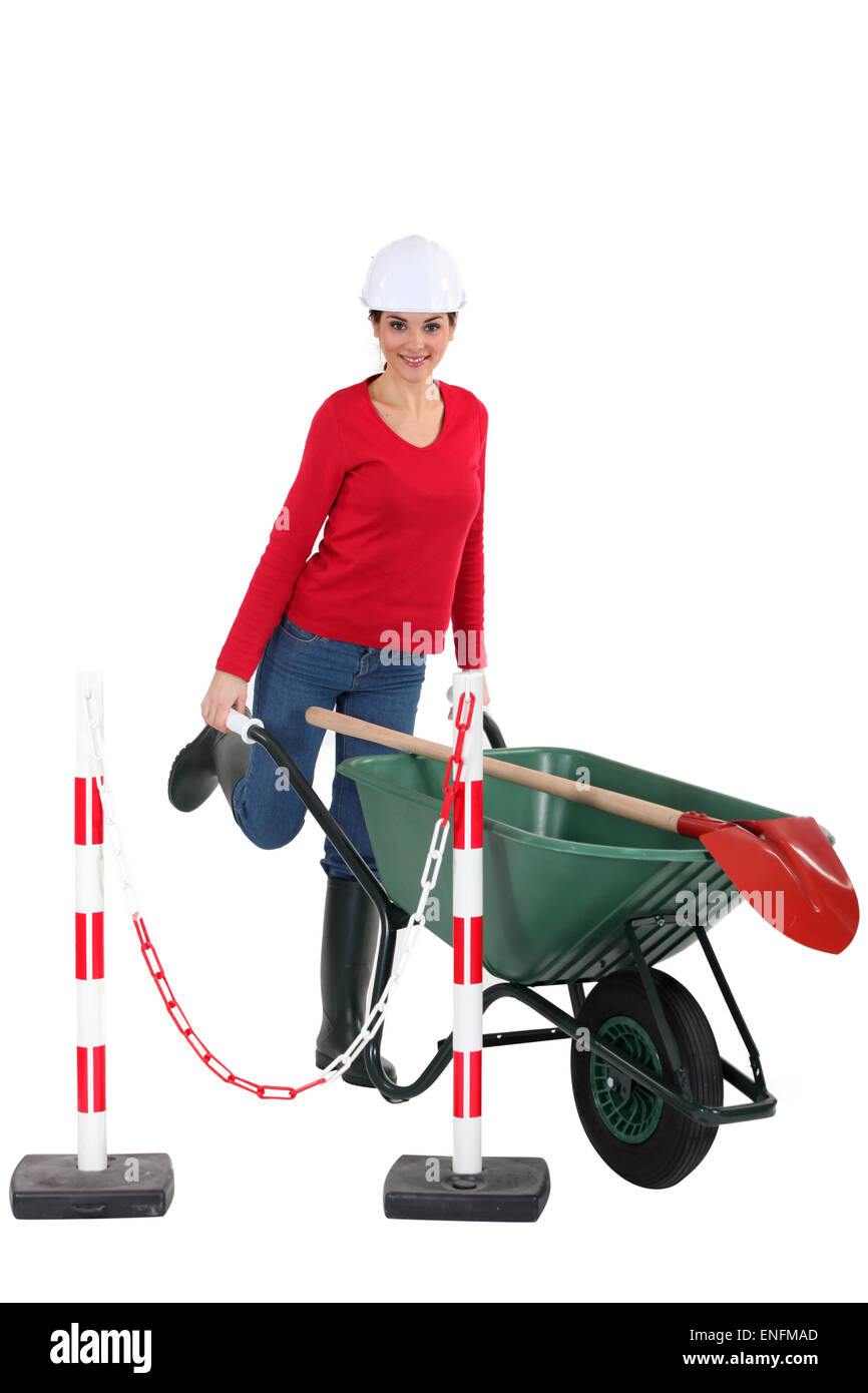 Construction Worker Pushing A Wheelbarrow High Resolution Stock ...