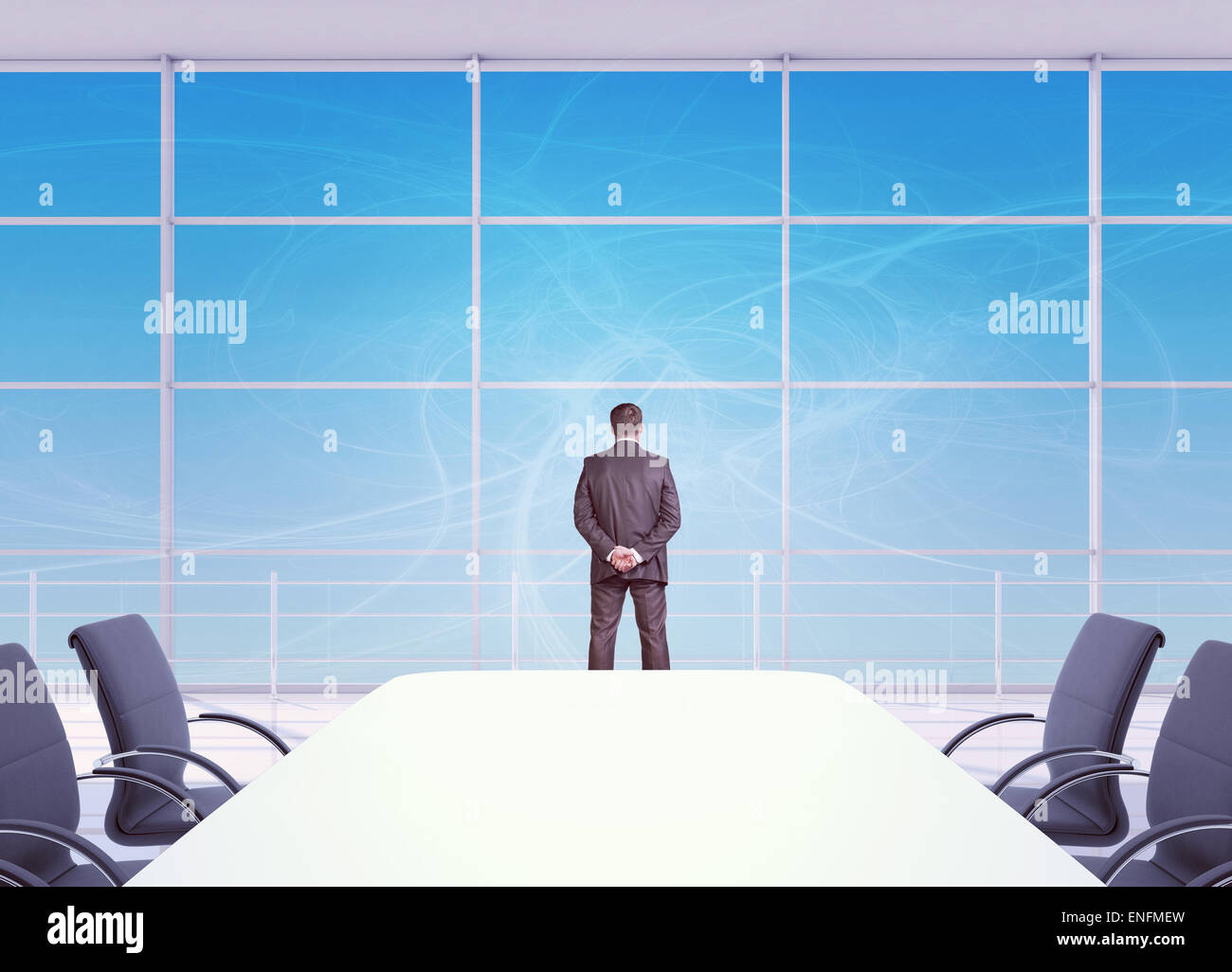 Businessman looking out office window Stock Photo - Alamy
