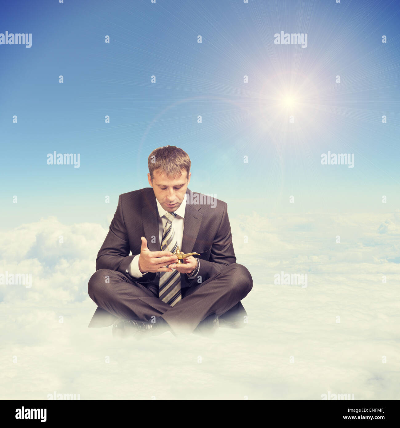 Businessman in suit sitting lotus position Stock Photo - Alamy
