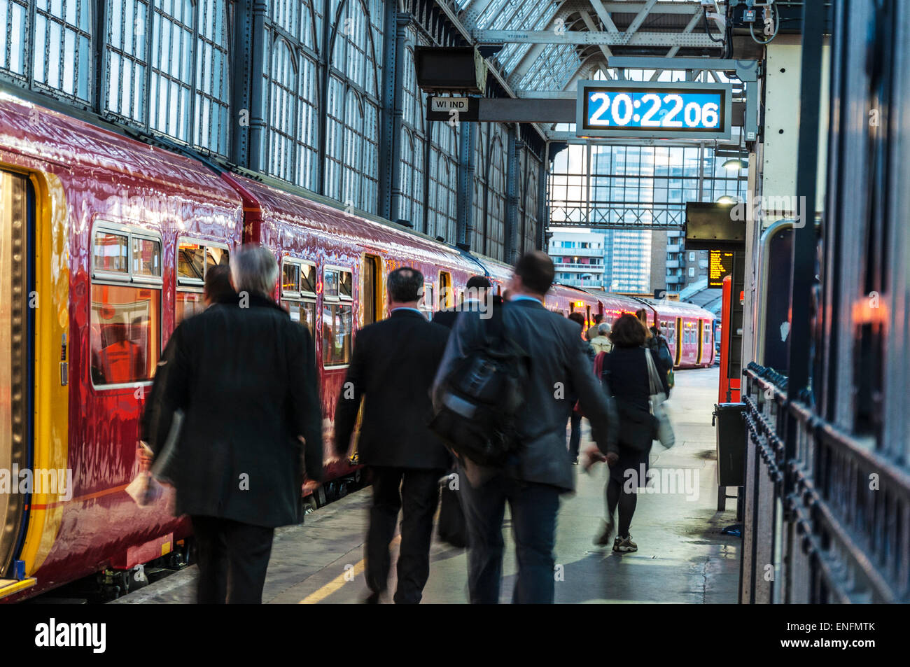 Commuters in motion going home on a train platform from London Waterloo ...