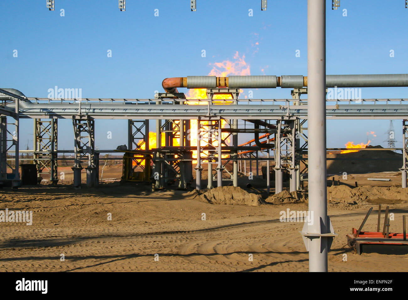 Gas and oil pipes with fire Stock Photo - Alamy