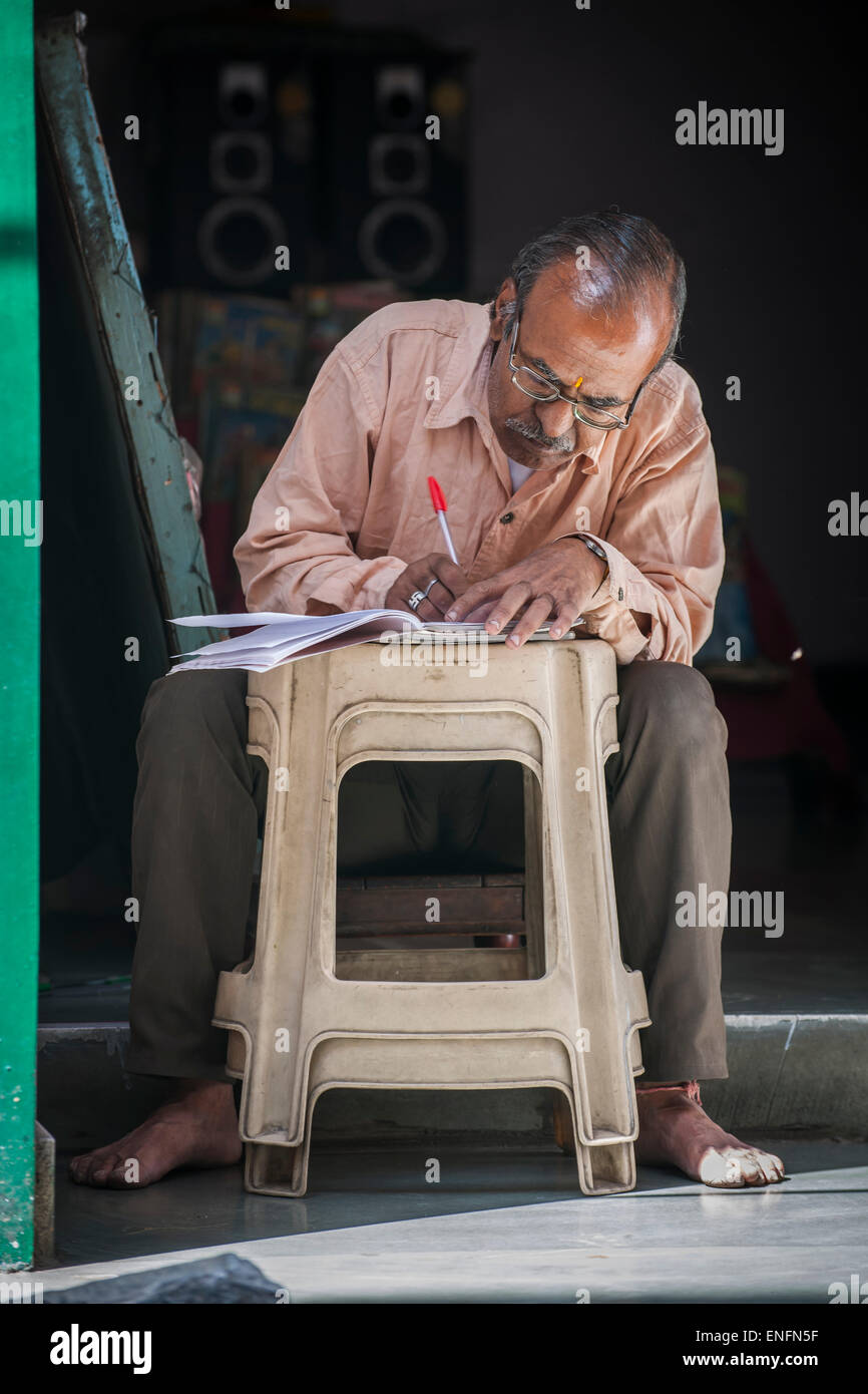 Merchant doing office work, Udaipur, Rajasthan, India Stock Photo - Alamy