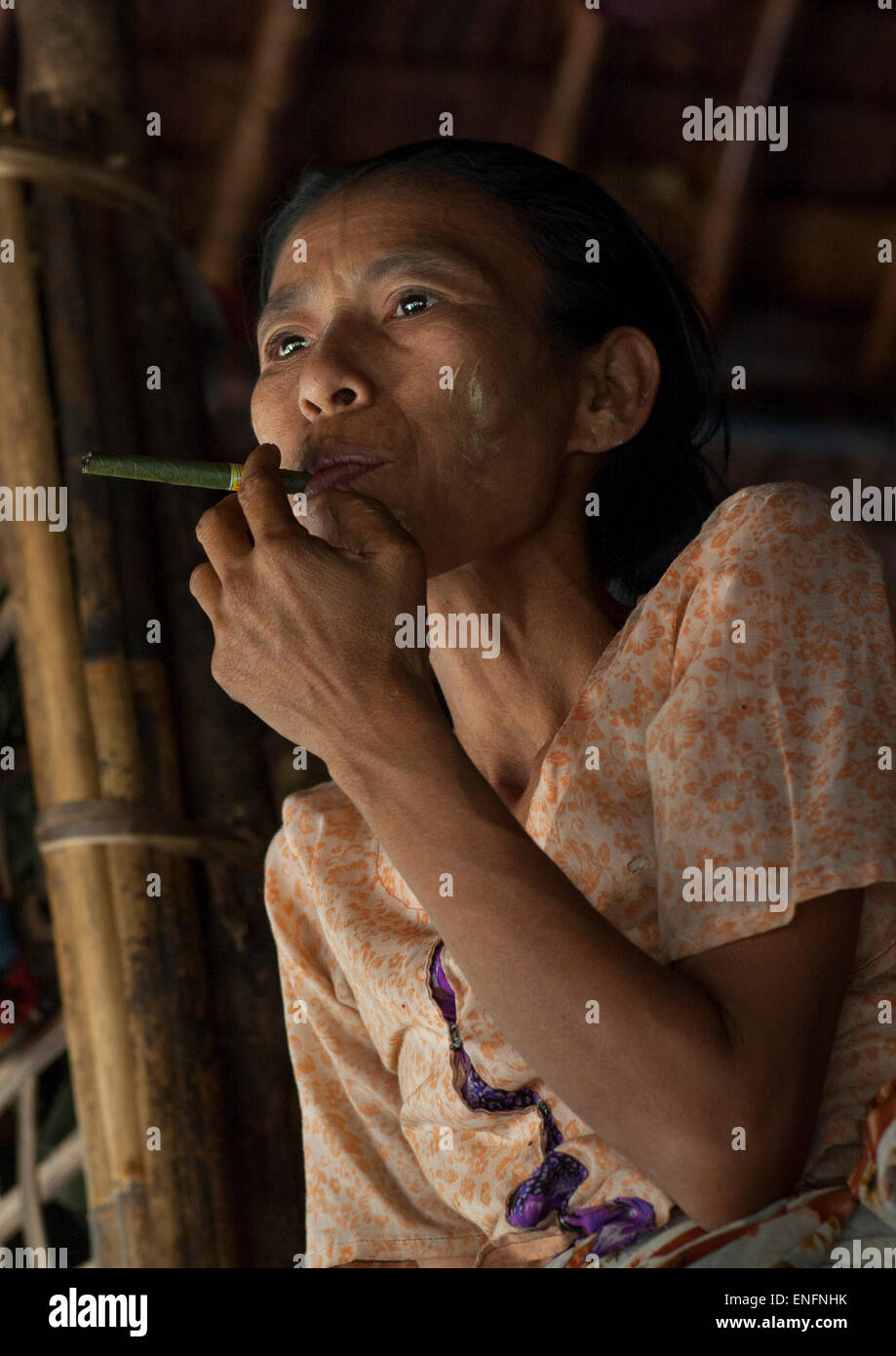 Burmese Woman Smoking A Cigar, Mrauk U, Myanmar Stock Photo - Alamy