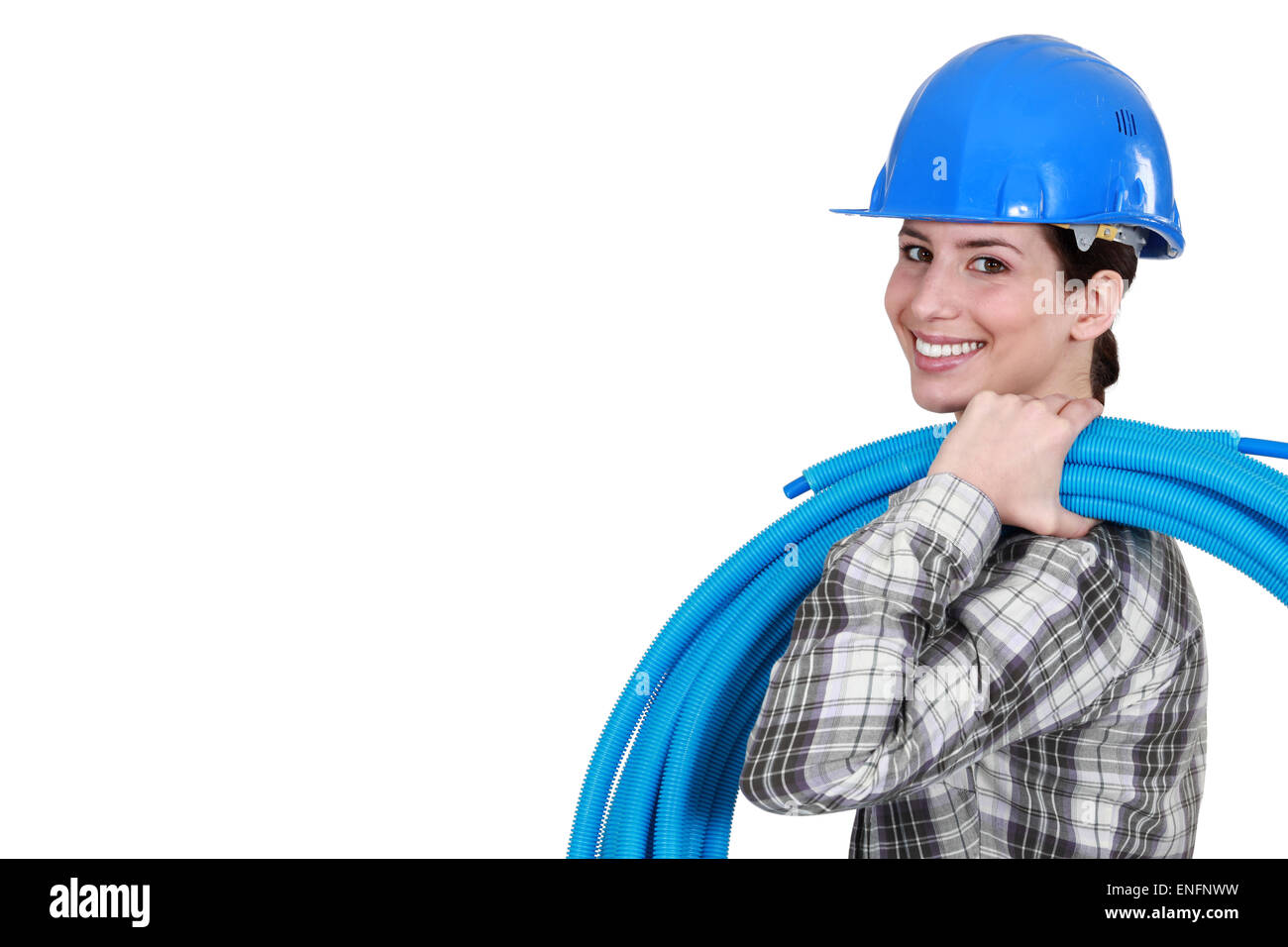 Female plumber carrying pipes Stock Photo - Alamy