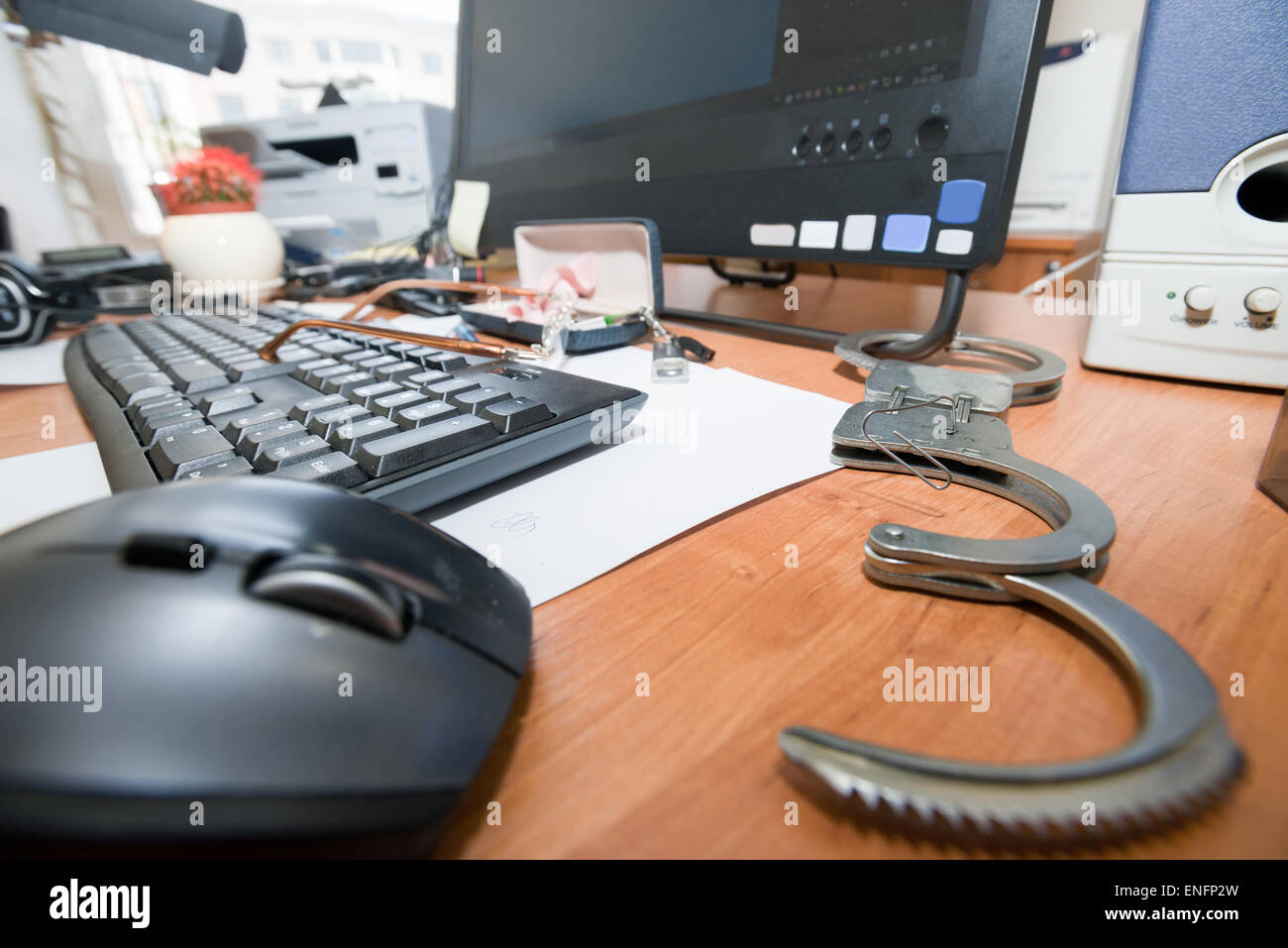 Handcuffs open paper clip on the table office worker Stock Photo - Alamy