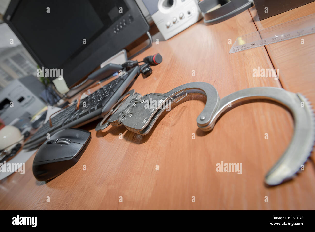 Handcuffs open paper clip on the table office worker Stock Photo - Alamy