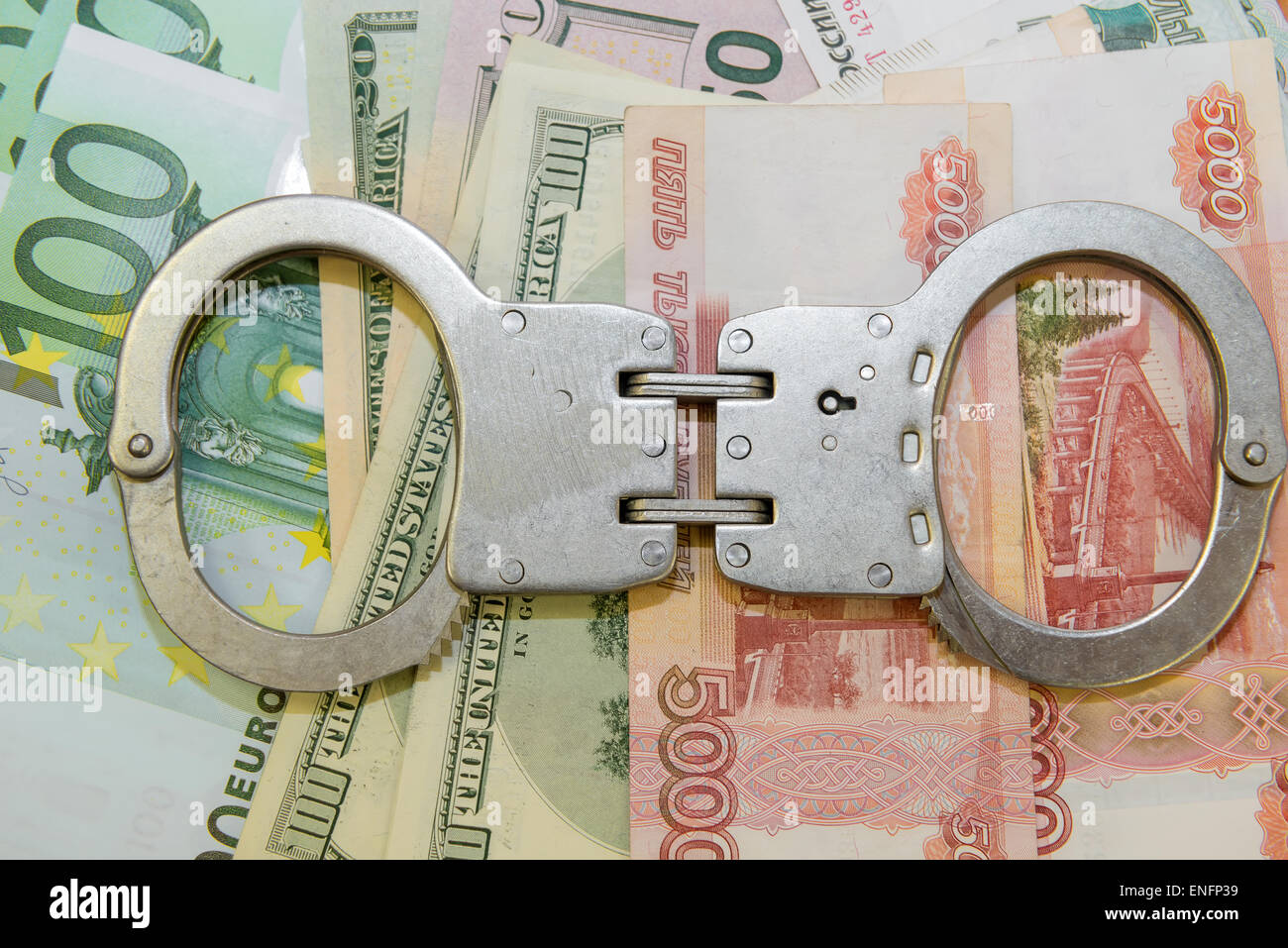 Money handcuffs hi-res stock photography and images - Alamy