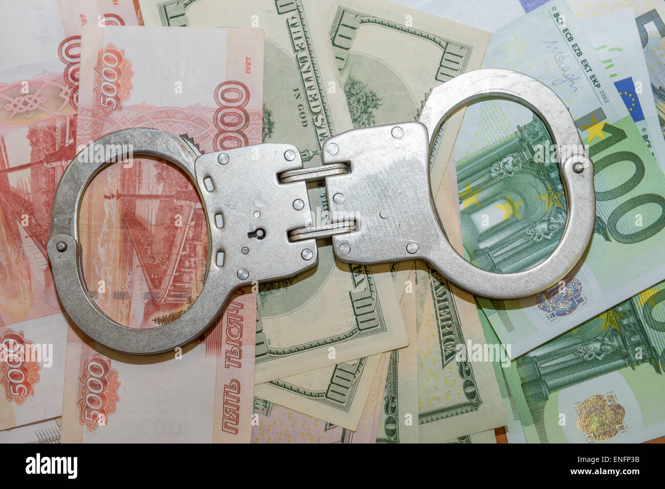 Money handcuffs hi-res stock photography and images - Alamy