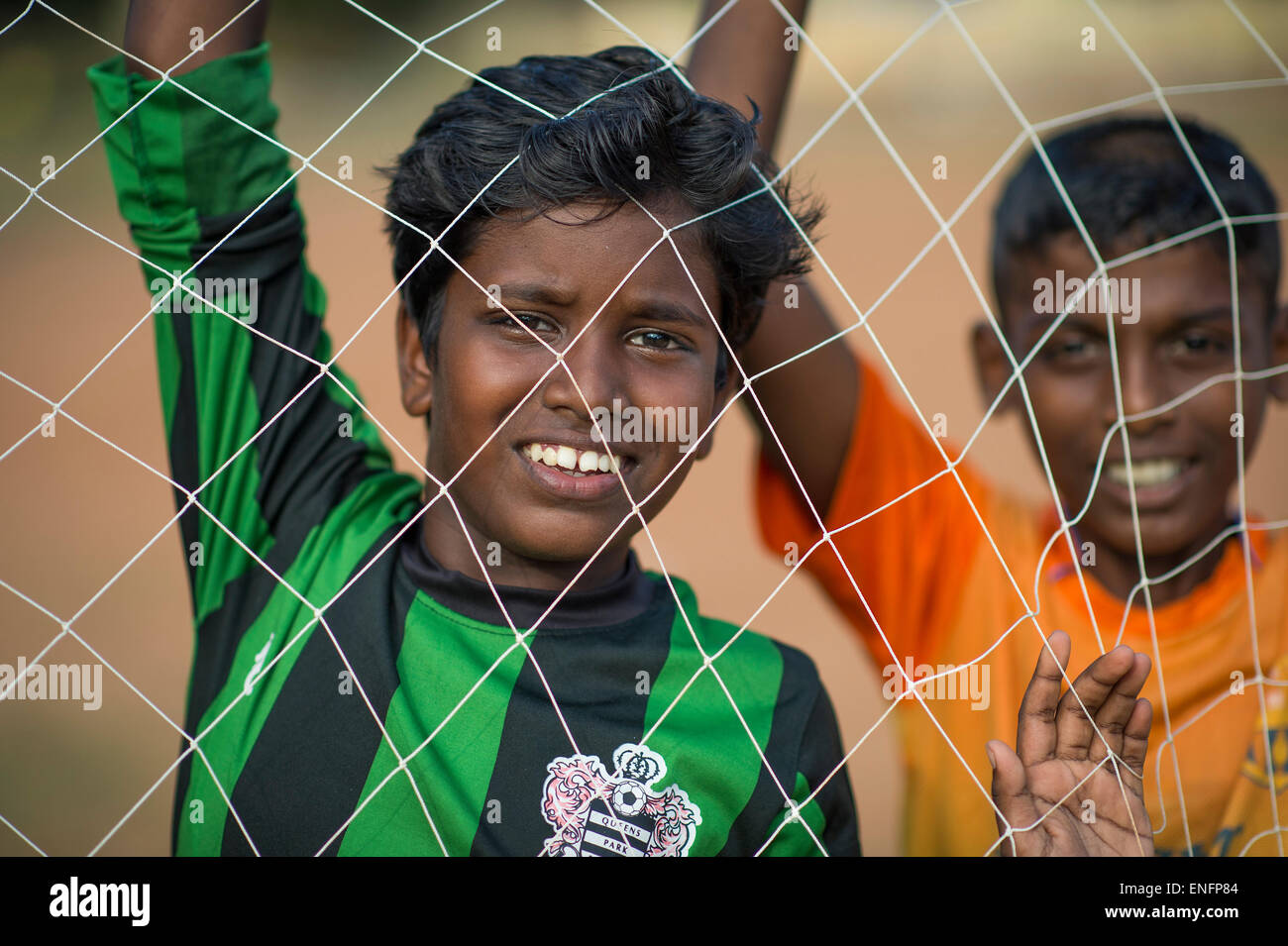 Boys looking through goal net, Parade Ground, Fort Cochin, Kochi ...