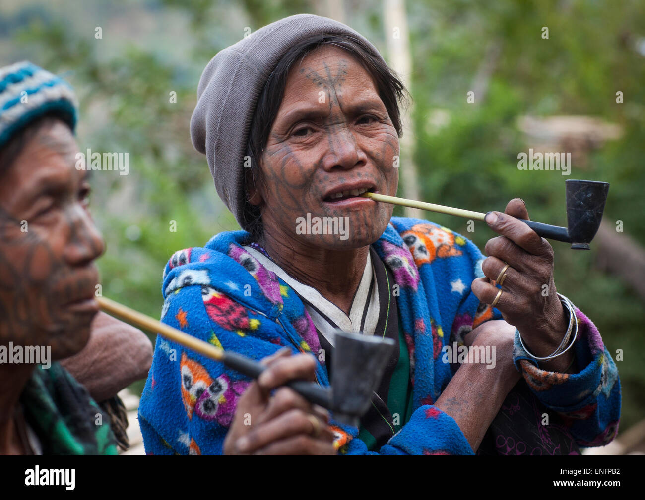 Tribal Chin Women From Muun Tribe With Tattoos On The Face Smoking ...
