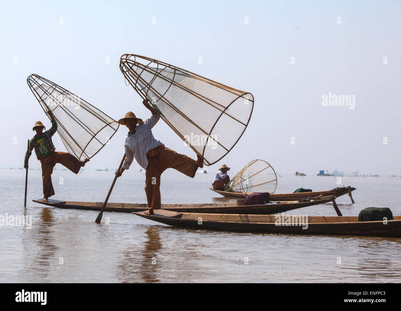 Traditional Fishermen With Fish Trap In Boat, Inle Lake, Myanmar Stock ...