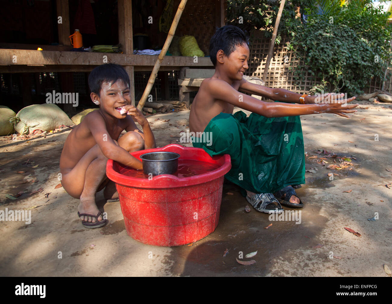 Rohingya Children Having A Bath, Thandwe, Myanmar Stock Photo - Alamy
