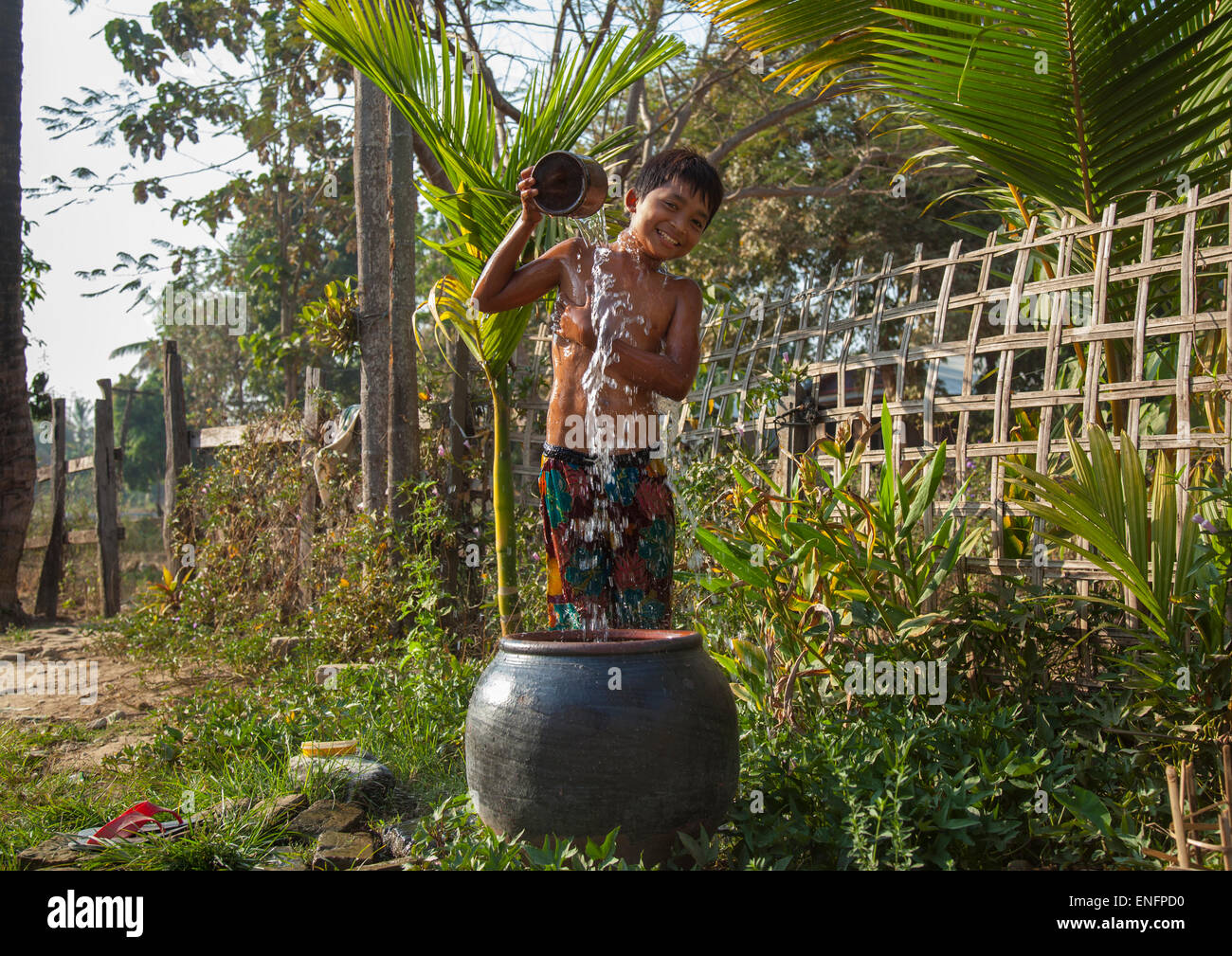 Rohingya Child Having A Bath, Thandwe, Myanmar Stock Photo - Alamy