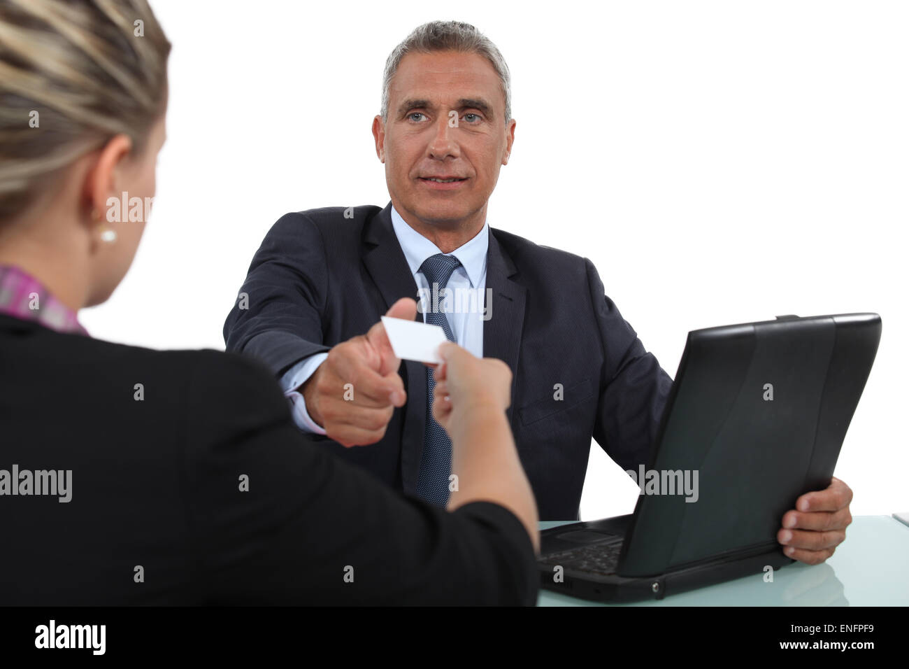 Woman handing over her card Stock Photo - Alamy
