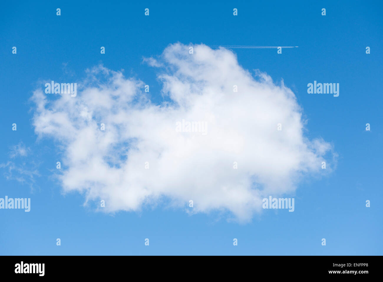 Aircraft flying past a cloud Stock Photo - Alamy