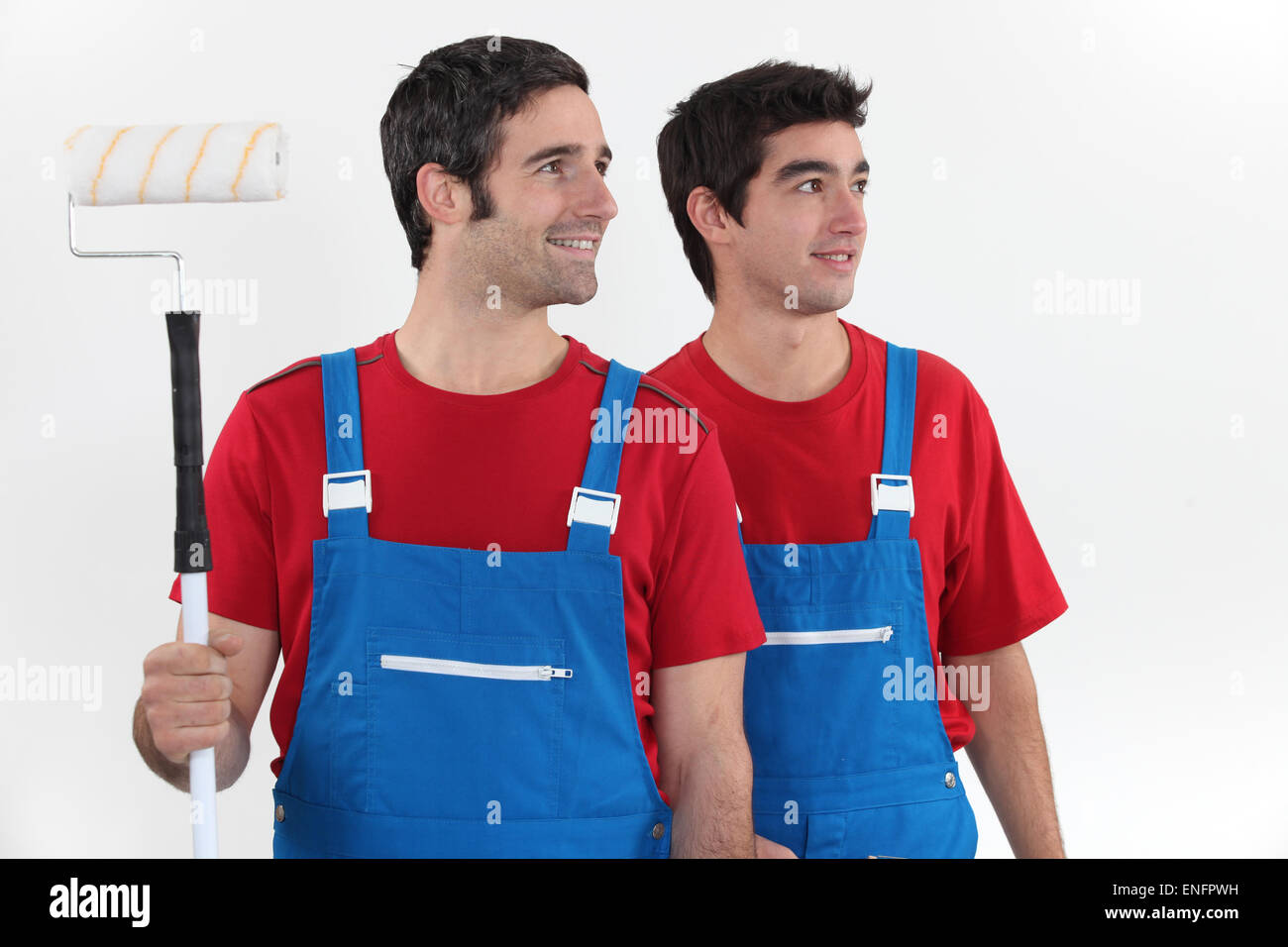 Two men painters on white background Stock Photo - Alamy