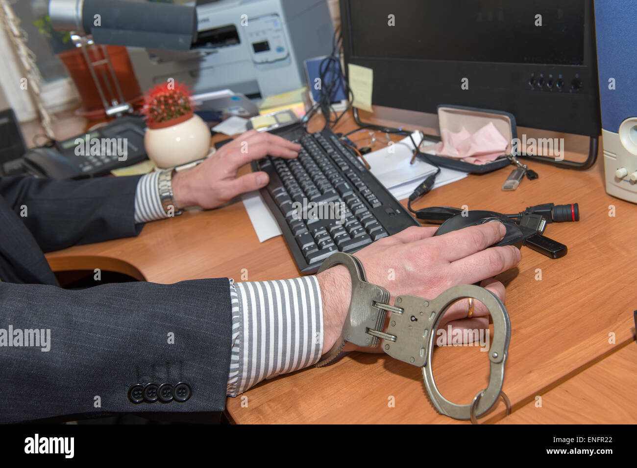 Office worker chained to the workplace Stock Photo - Alamy