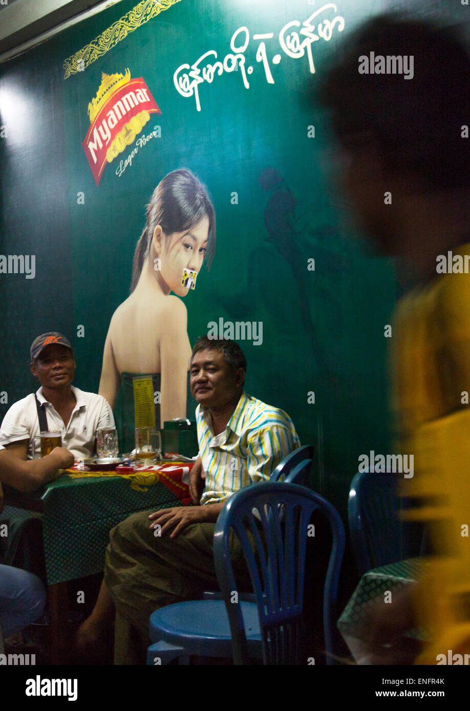 Men Inside A Bar In Front Of A Big Advertising, Yangon, Myanmar Stock ...