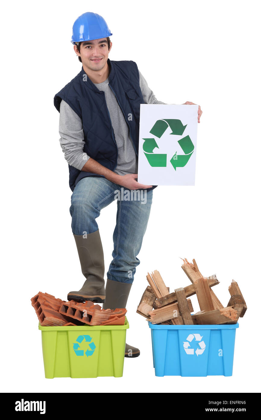 Builder recycling old material Stock Photo - Alamy