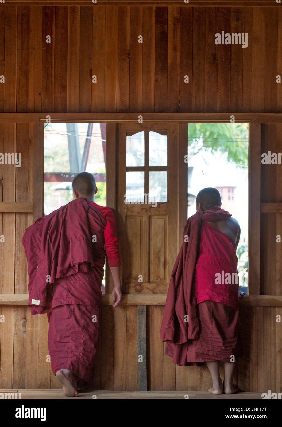 Novices Monks Looking Thru A Window, Inle Lake, Myanmar Stock Photo - Alamy