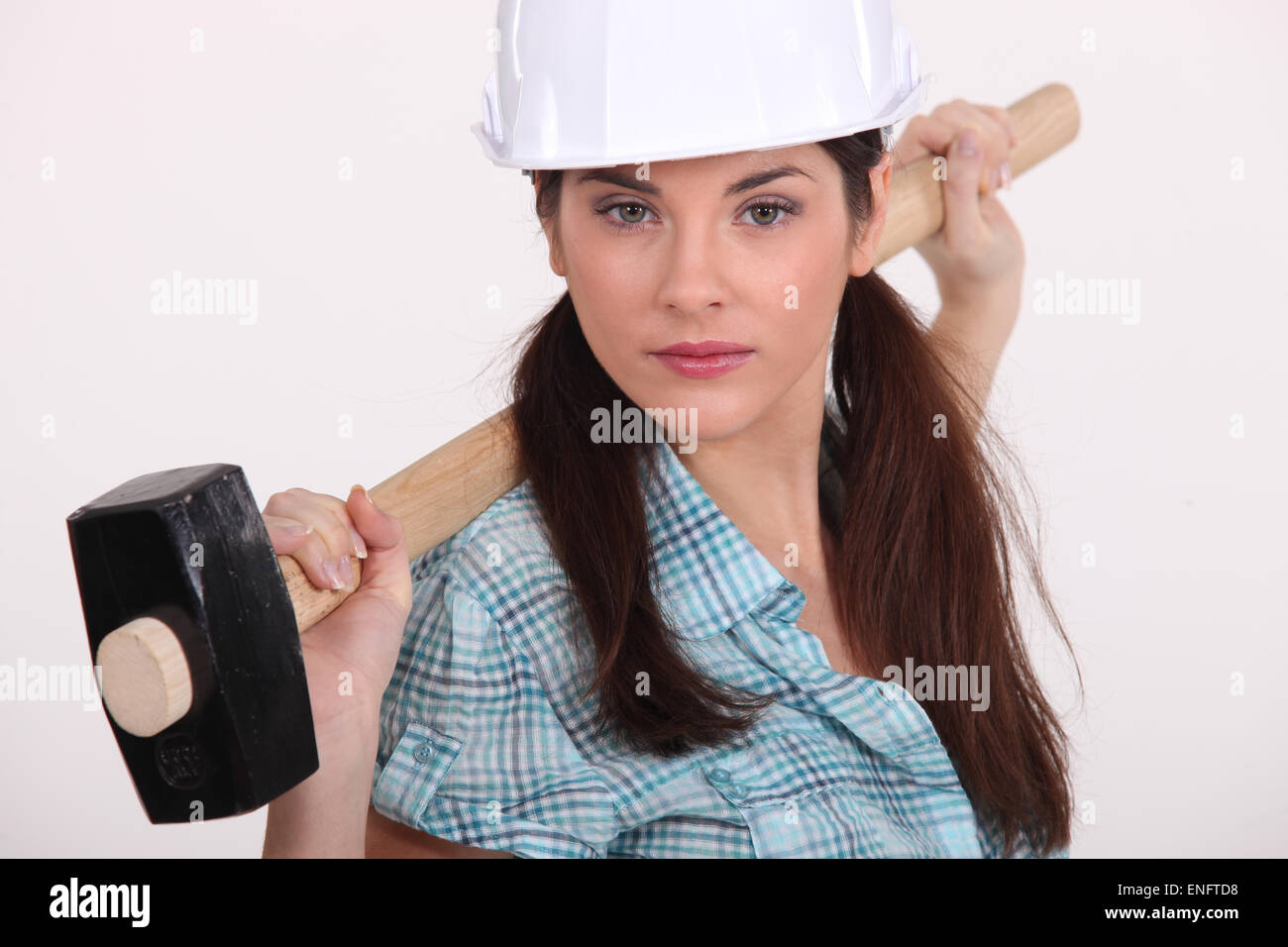 Woman holding hammer Stock Photo - Alamy