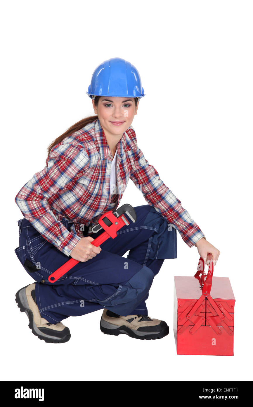 A female construction worker holding a wrench Stock Photo - Alamy
