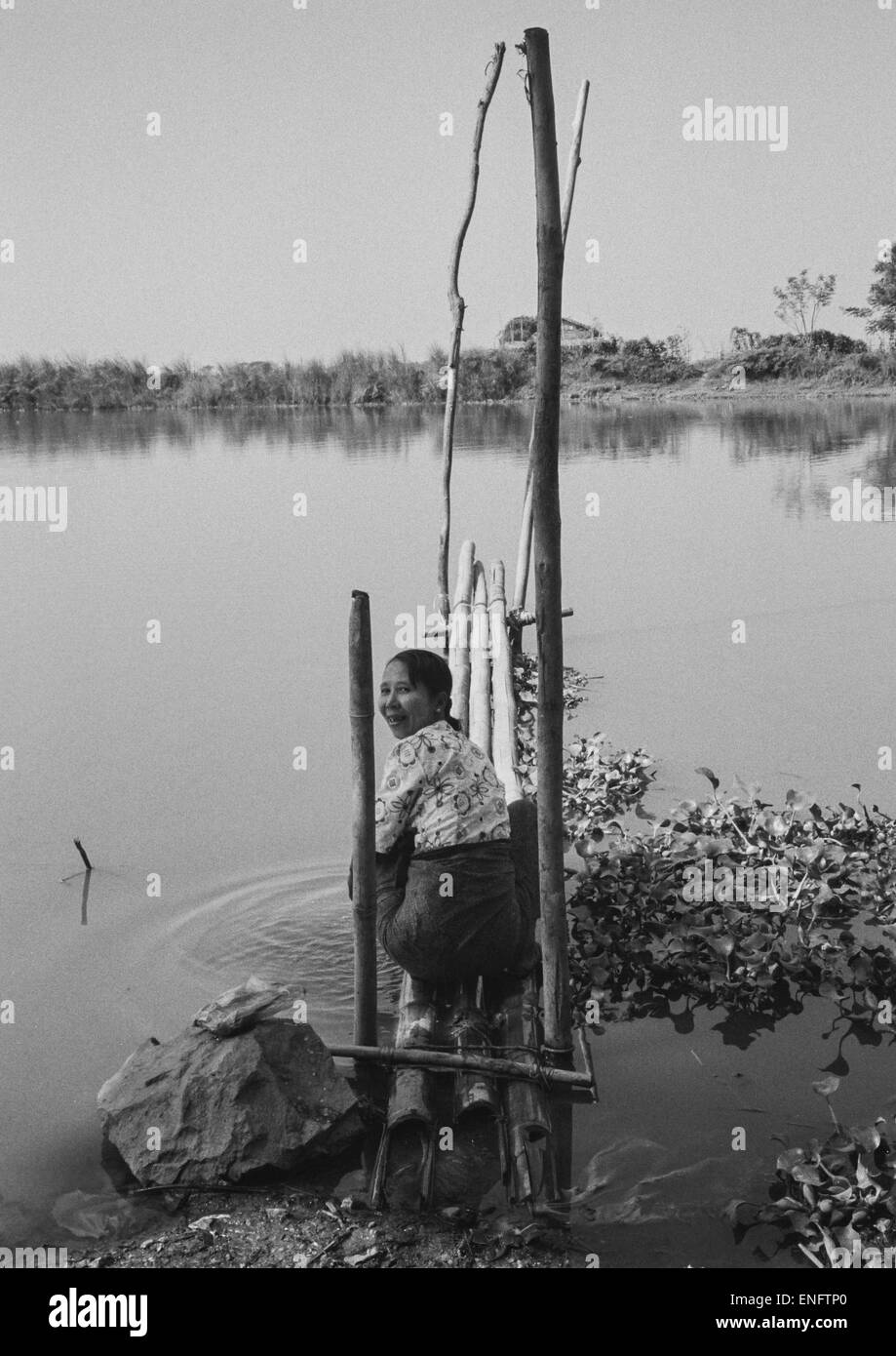 Woman Washing Clothes In The Water, Inle Lake, Myanmar Stock Photo - Alamy