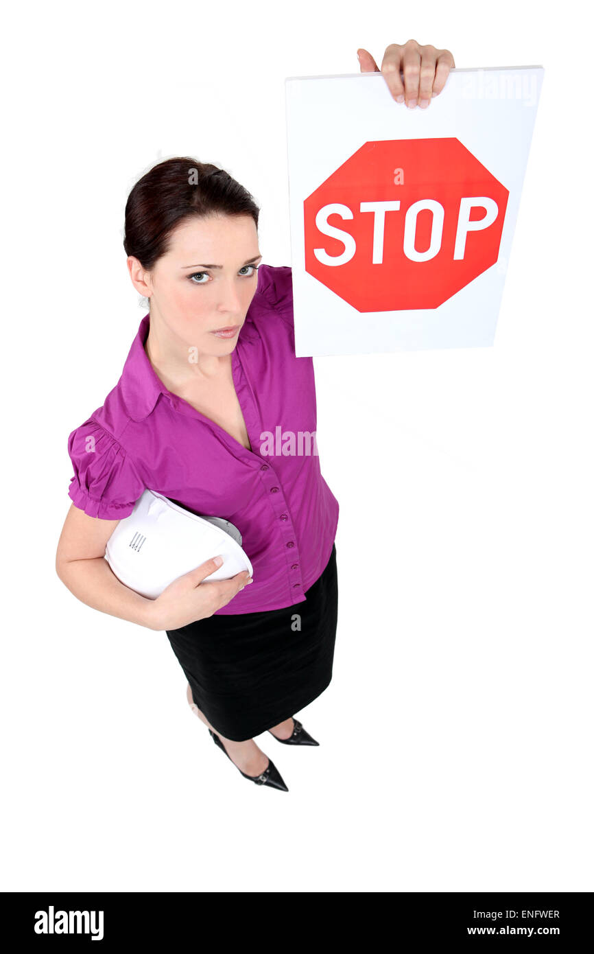 Businesswoman holding stop sign Stock Photo - Alamy
